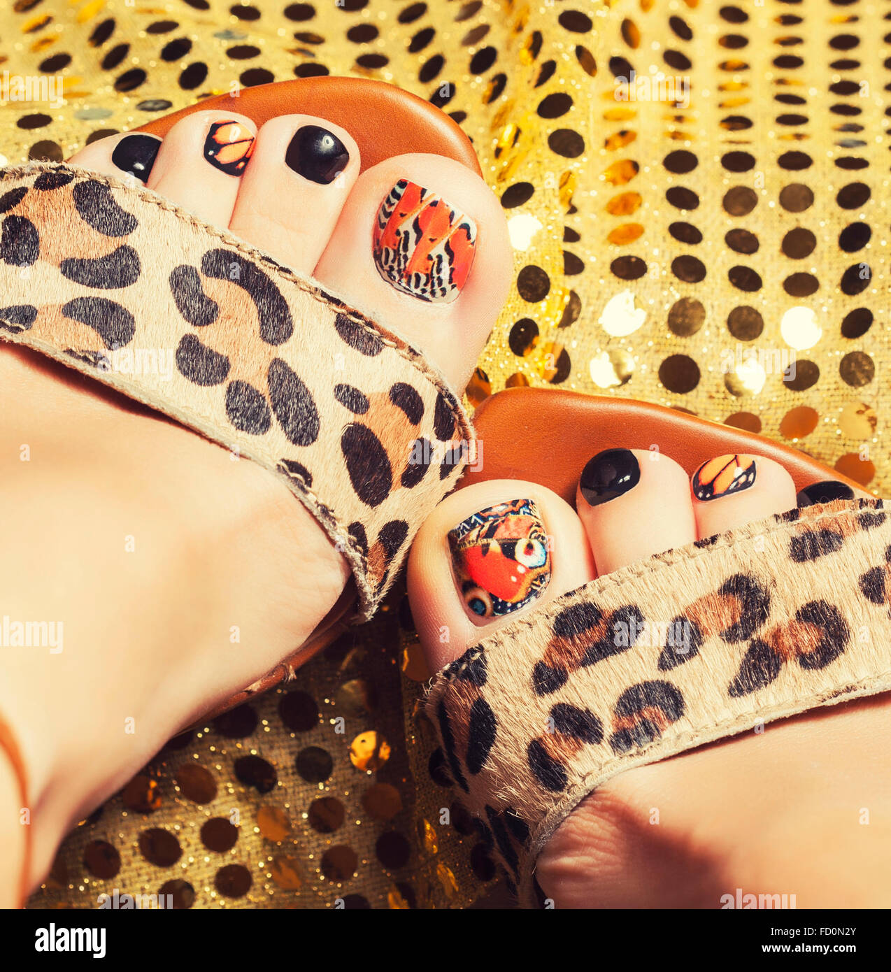 photo of pedicure like butterfly design on gold background Stock Photo ...