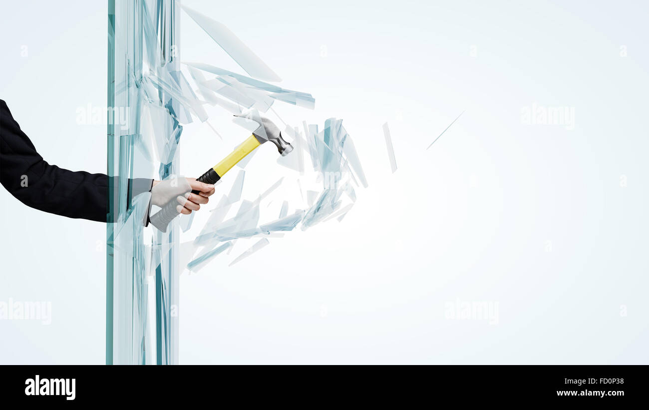 Close up of male hand breaking glass with hammer Stock Photo - Alamy