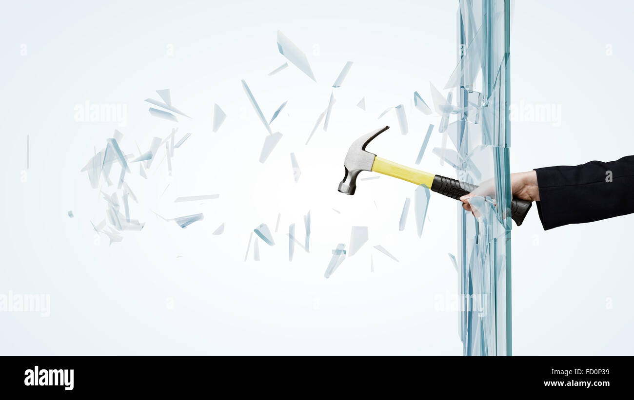 Close up of male hand breaking glass with hammer Stock Photo - Alamy
