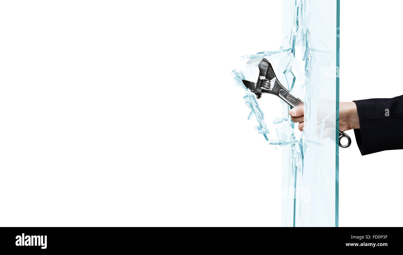 Close up of male hand breaking glass with wrench Stock Photo - Alamy