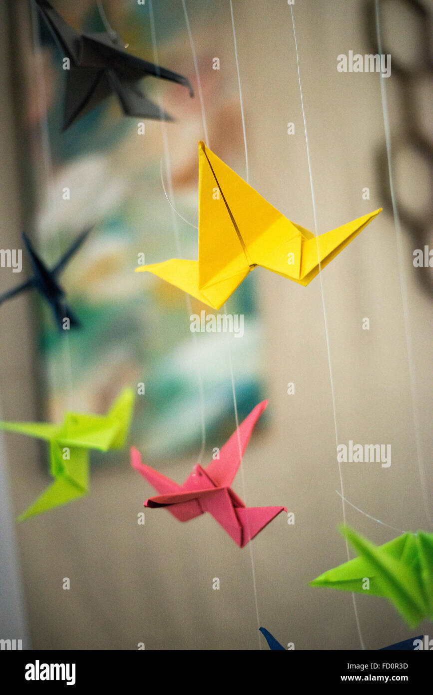 Colorful paper Origami birds in flight Stock Photo - Alamy