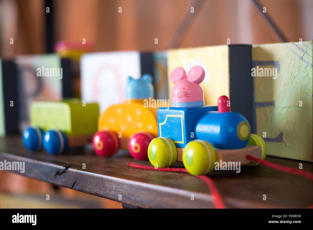 A colorful child's painted wooden pull toy train Stock Photo - Alamy