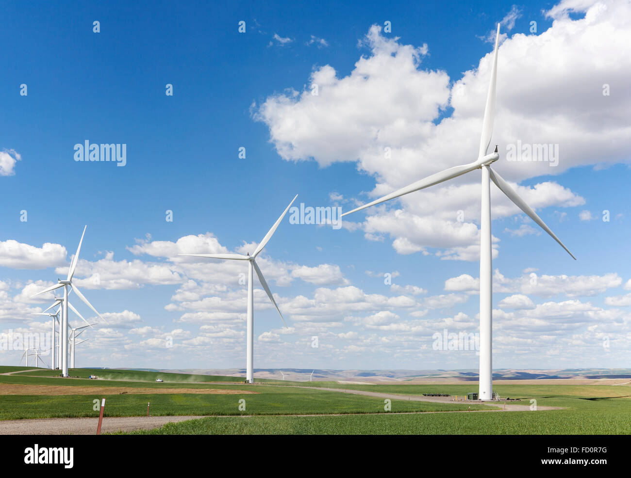 Windmill and wheat fields in Palouse region of Washington state showing ...