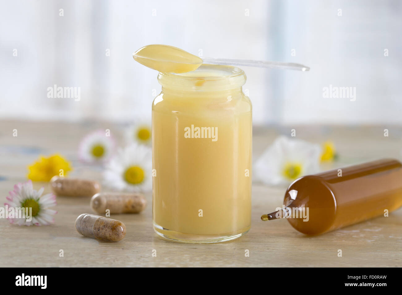 raw organic royal jelly in a small bottle Stock Photo - Alamy