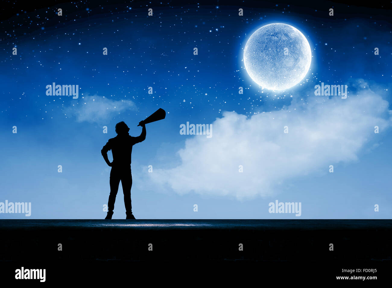Silhouette of man screaming in trumpet at night Stock Photo - Alamy