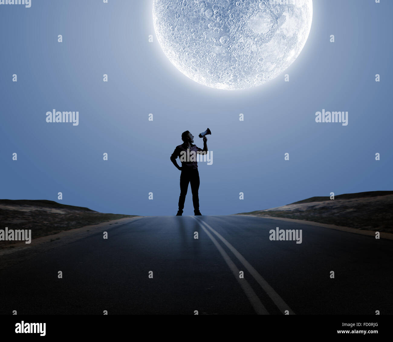 Silhouette of man screaming in trumpet at night Stock Photo - Alamy