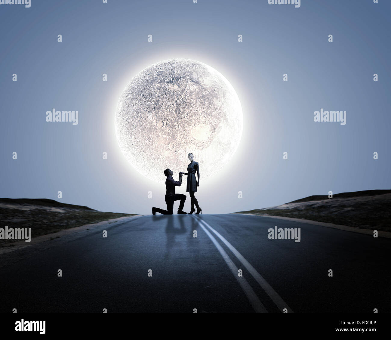 Silhouettes of man making proposal to woman Stock Photo - Alamy
