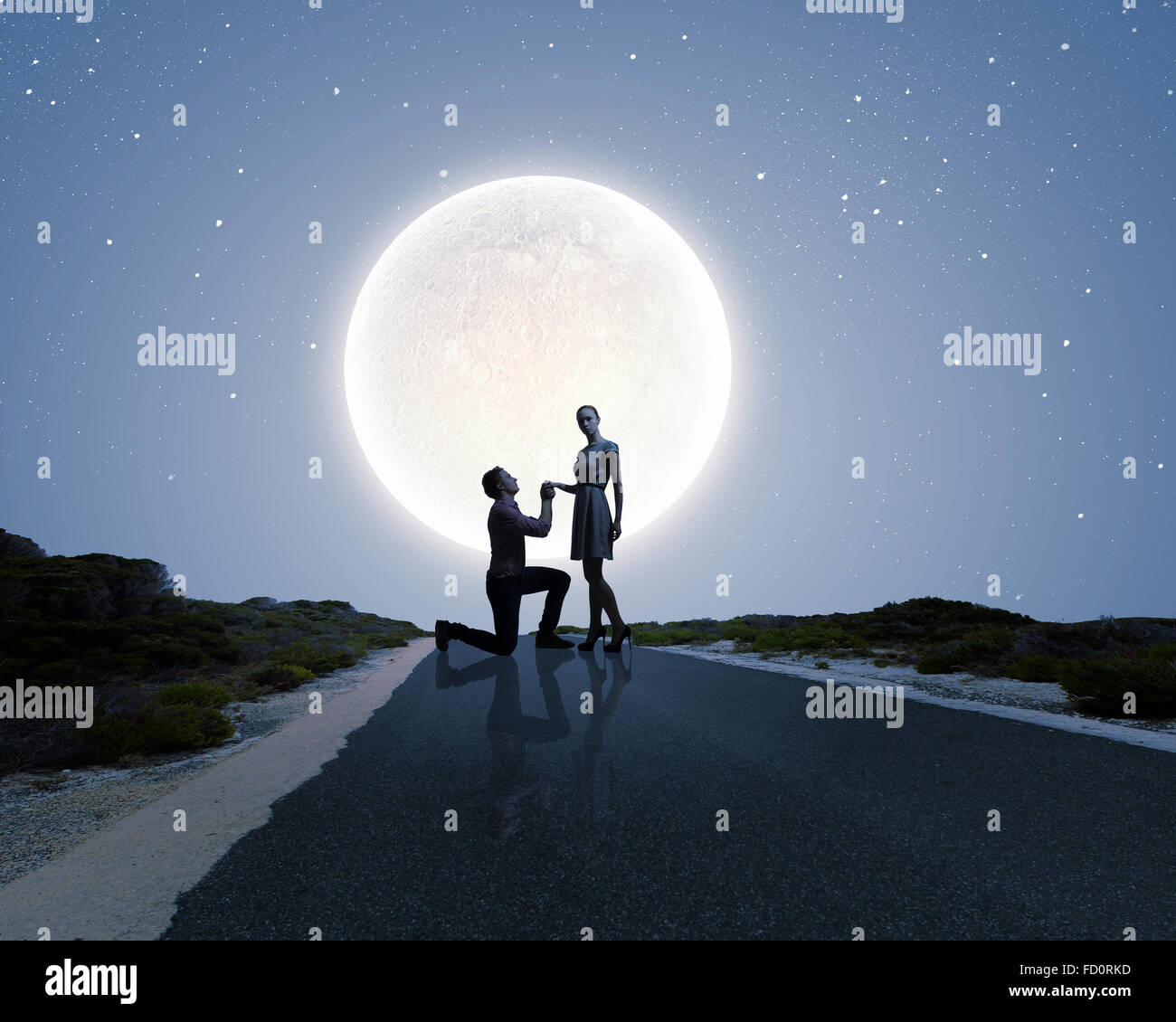 Silhouettes of man making proposal to woman Stock Photo - Alamy