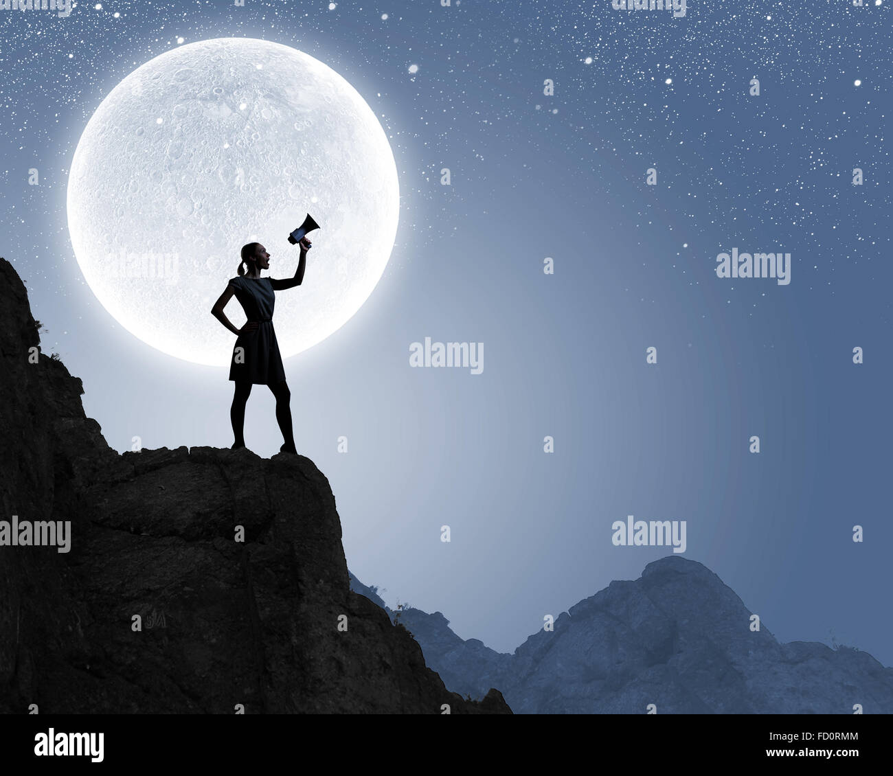 Silhouette of woman on top of rock screaming in megaphone Stock Photo ...