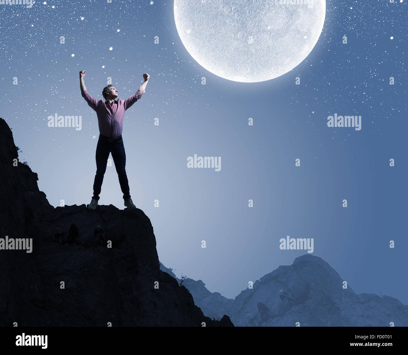 Young man at night with big full moon at background Stock Photo - Alamy