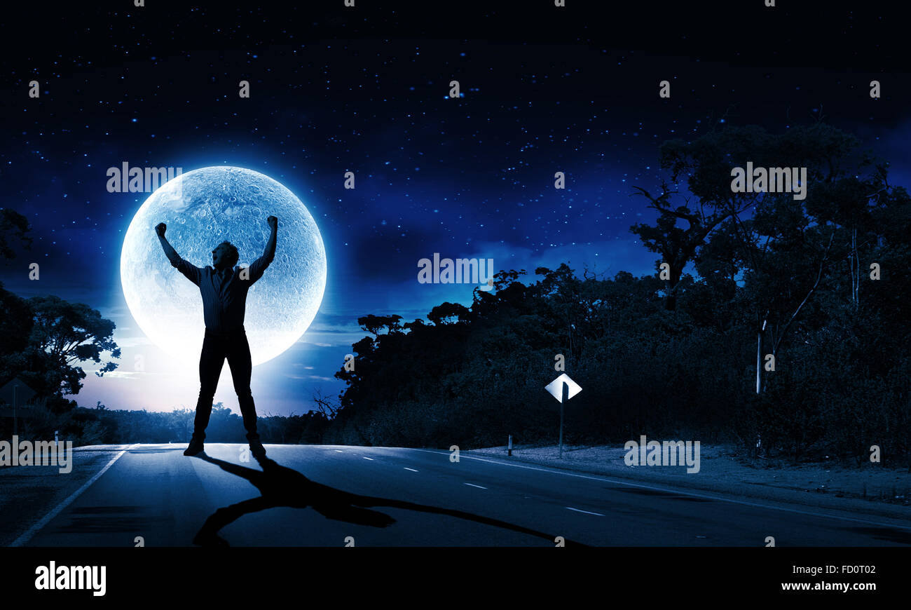 Young screaming man at night with big full moon at background Stock ...