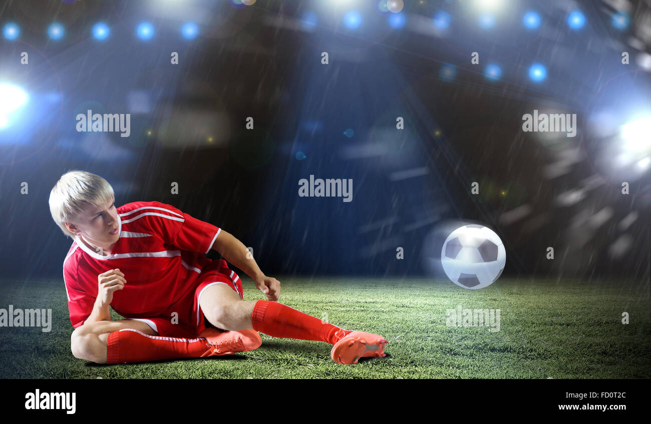 Slide tackle rain hi-res stock photography and images - Alamy