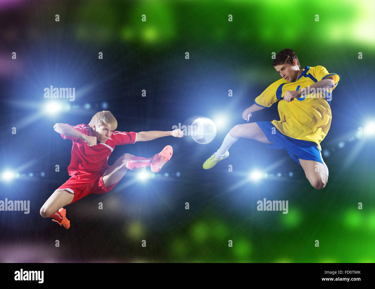 Two young football players struggling for ball Stock Photo - Alamy