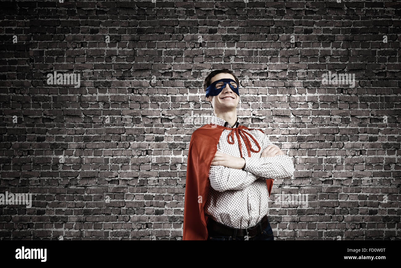 Young man wearing superman mask and cape Stock Photo - Alamy