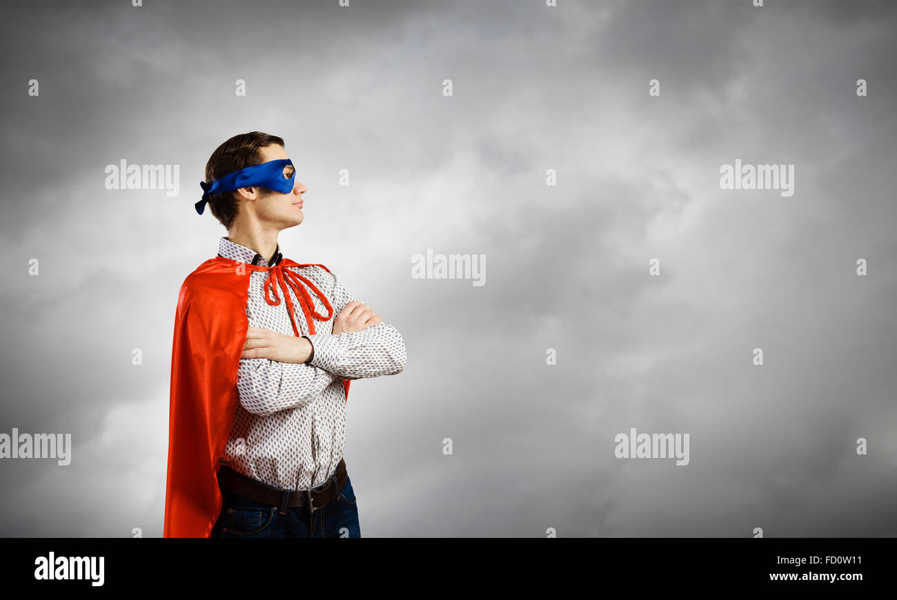 Young man wearing superman mask and cape Stock Photo - Alamy