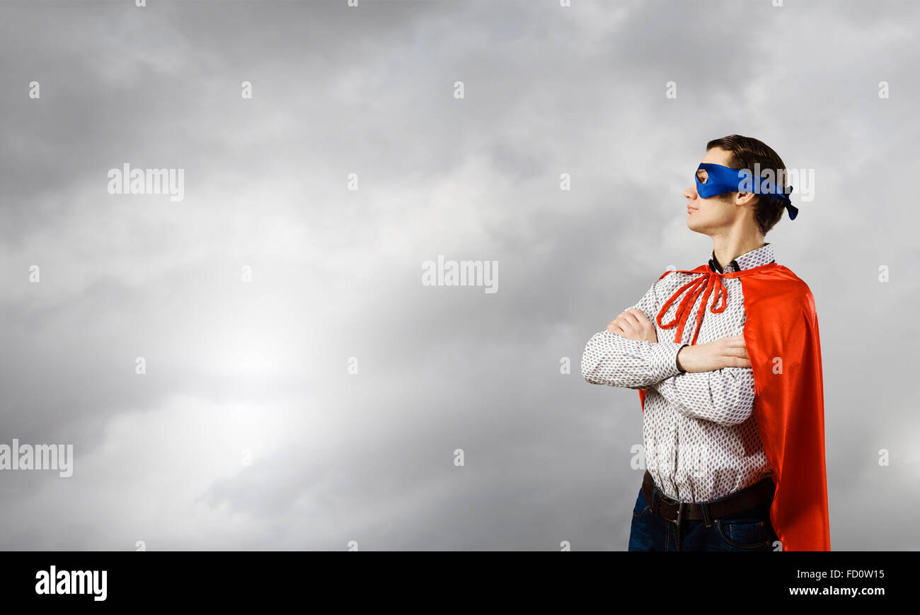 Young man wearing superman mask and cape Stock Photo - Alamy