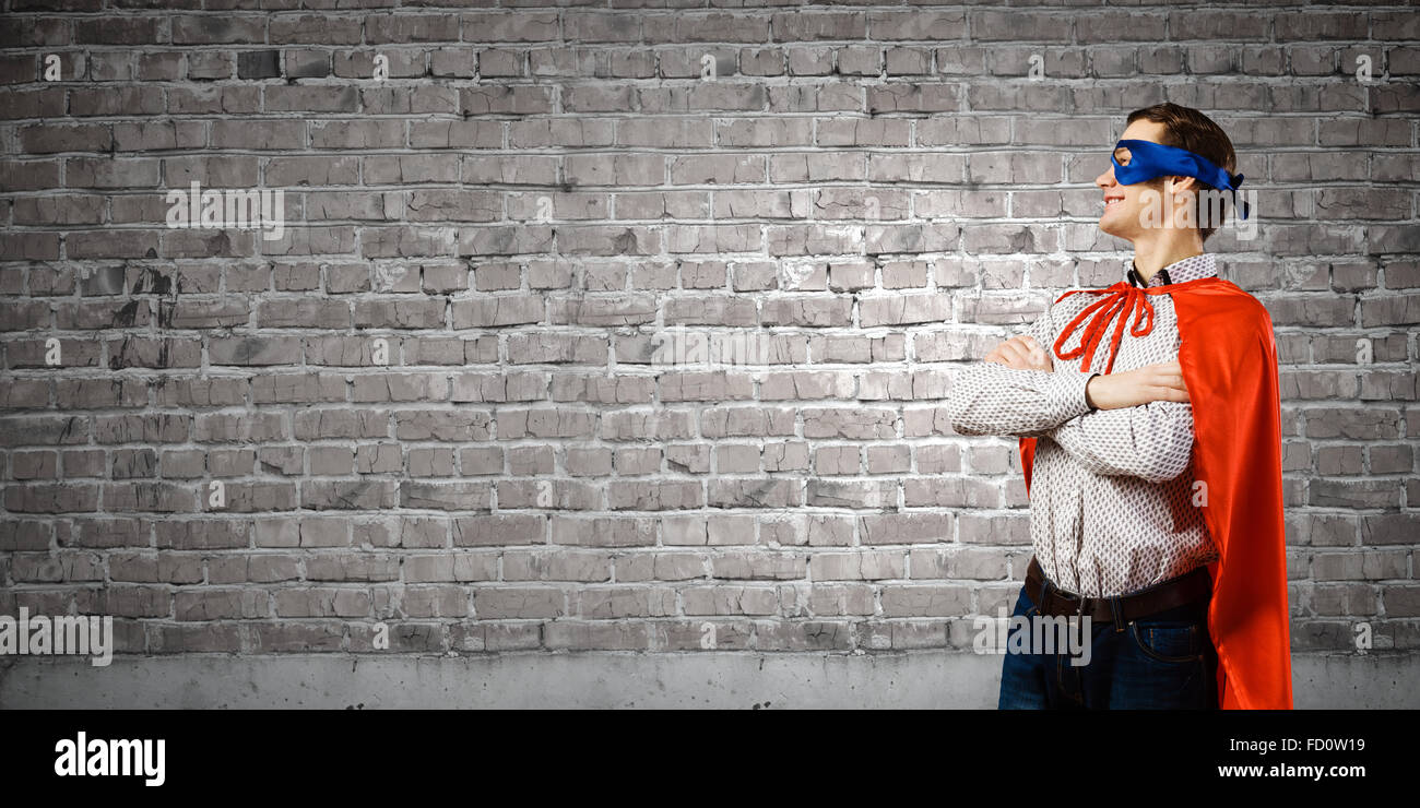Young man wearing superman mask and cape Stock Photo - Alamy