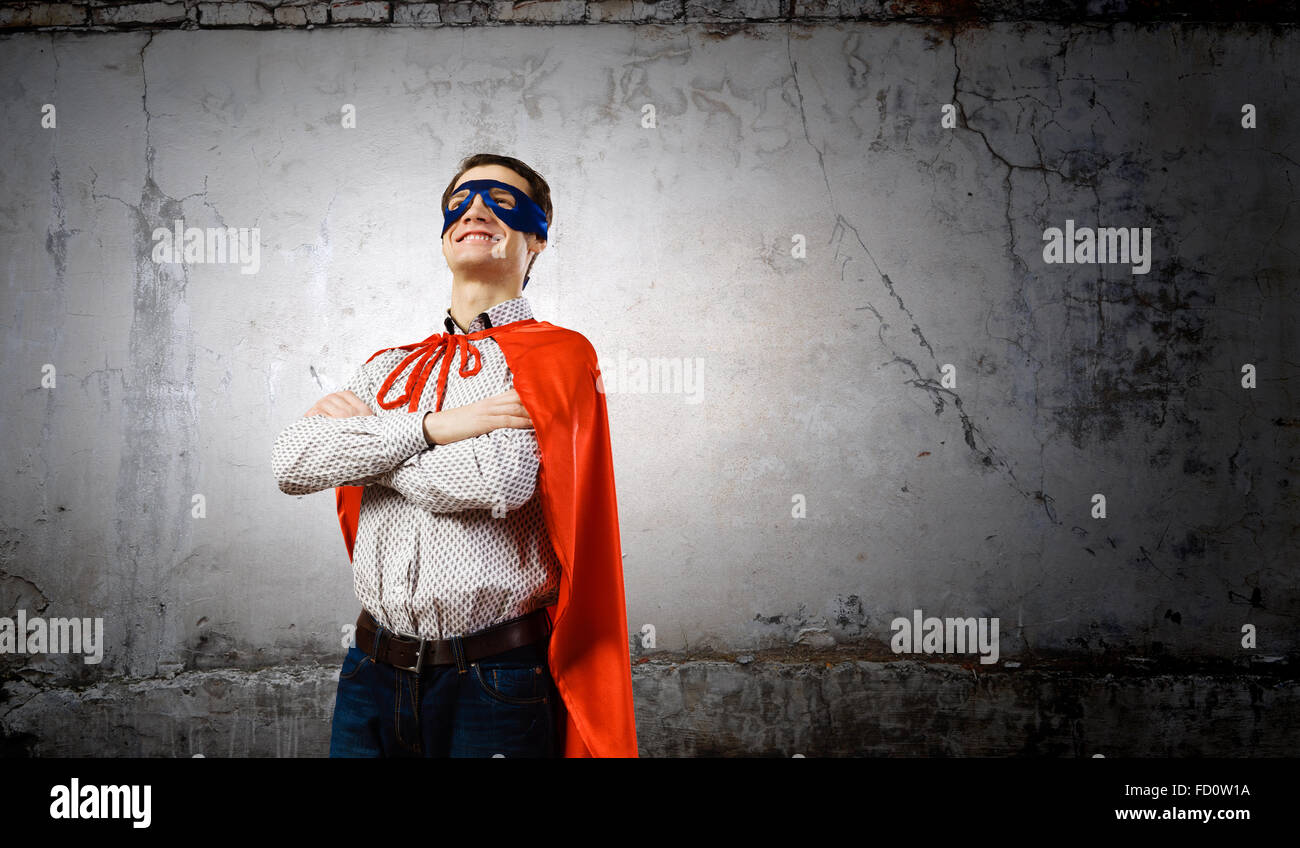Young man wearing superman mask and cape Stock Photo - Alamy