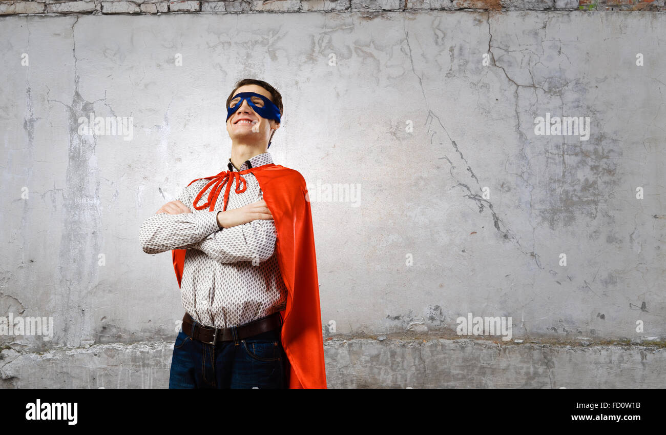 Young man wearing superman mask and cape Stock Photo - Alamy