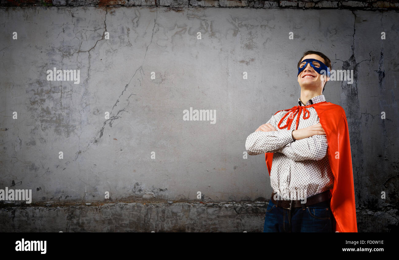 Young man wearing superman mask and cape Stock Photo - Alamy