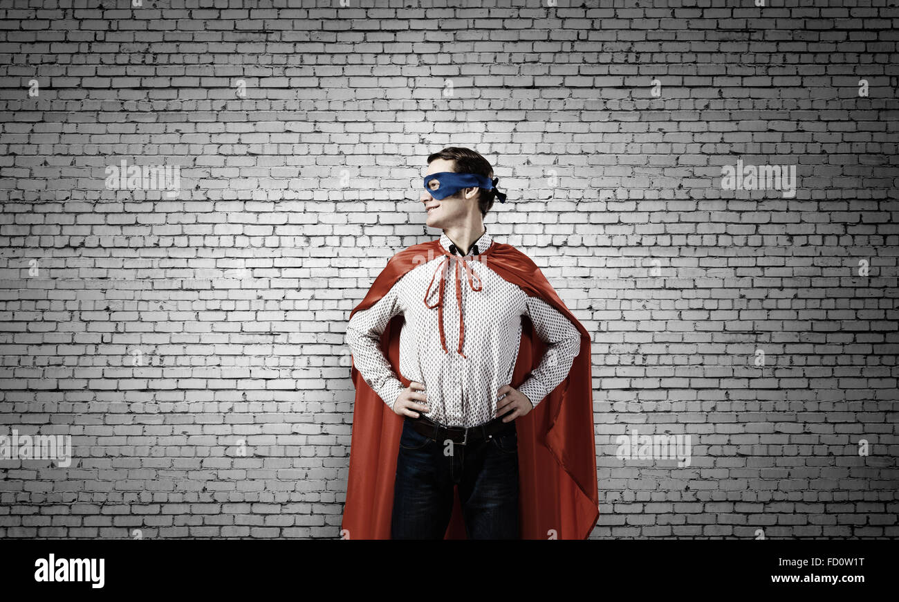 Young man wearing superman mask and cape Stock Photo - Alamy