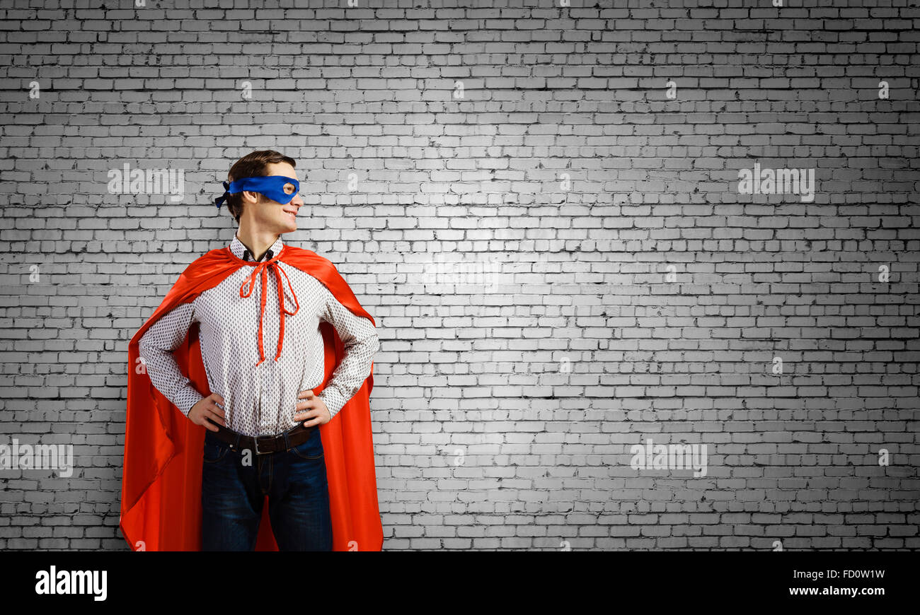 Young man wearing superman mask and cape Stock Photo - Alamy