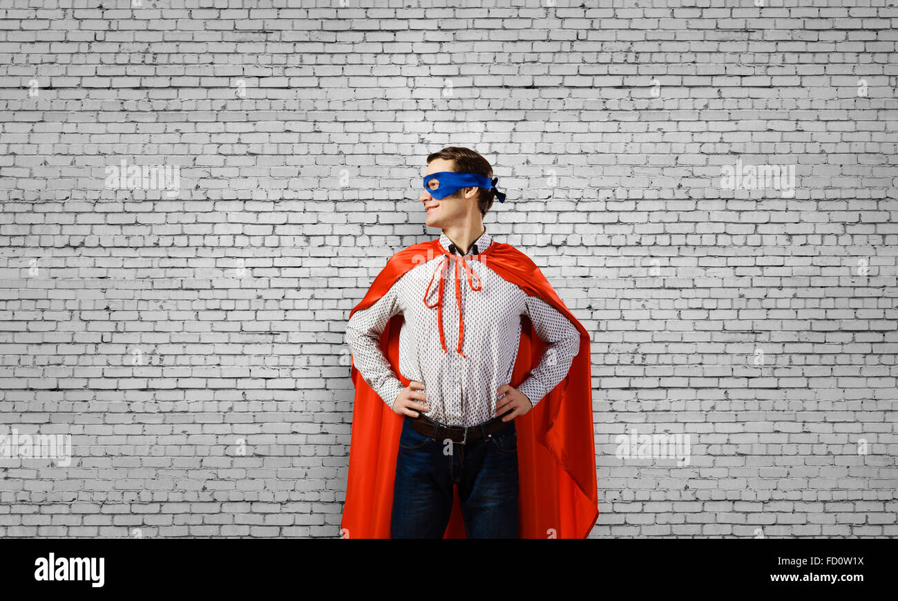 Young man wearing superman mask and cape Stock Photo - Alamy