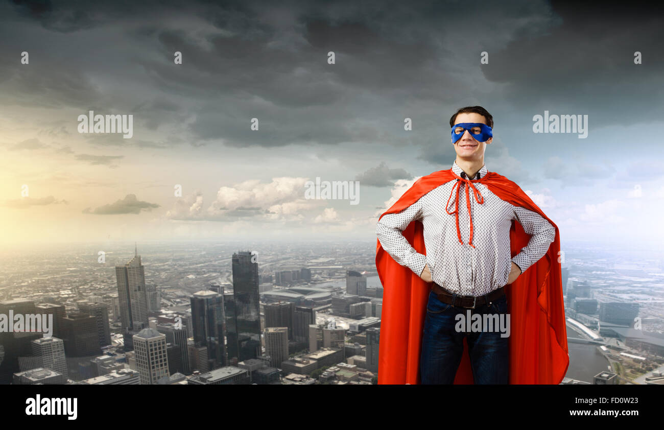 Young man wearing superman mask and cape Stock Photo - Alamy