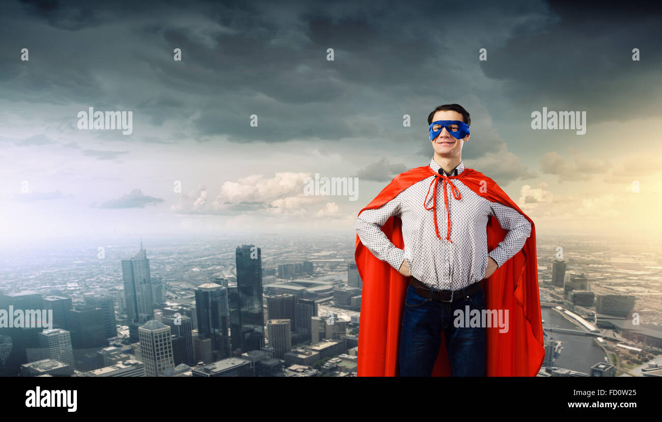 Young man wearing superman mask and cape Stock Photo - Alamy
