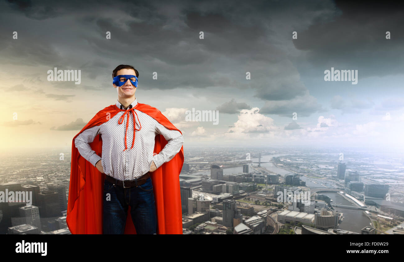 Young man wearing superman mask and cape Stock Photo - Alamy