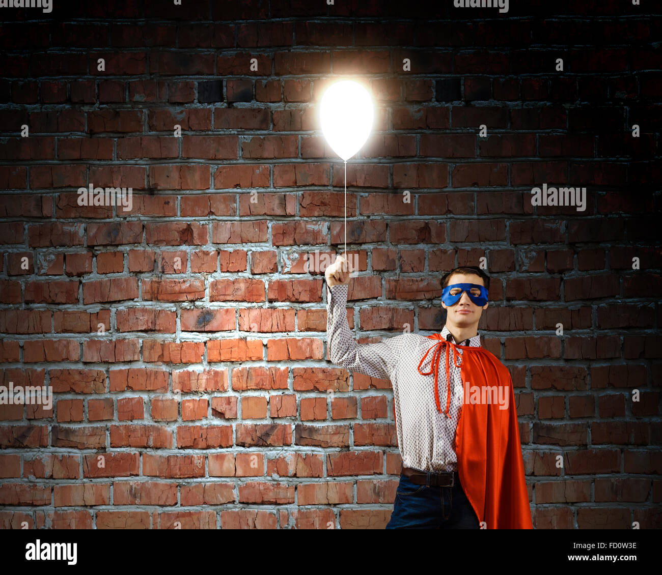 Young confident superman in mask and cape Stock Photo - Alamy