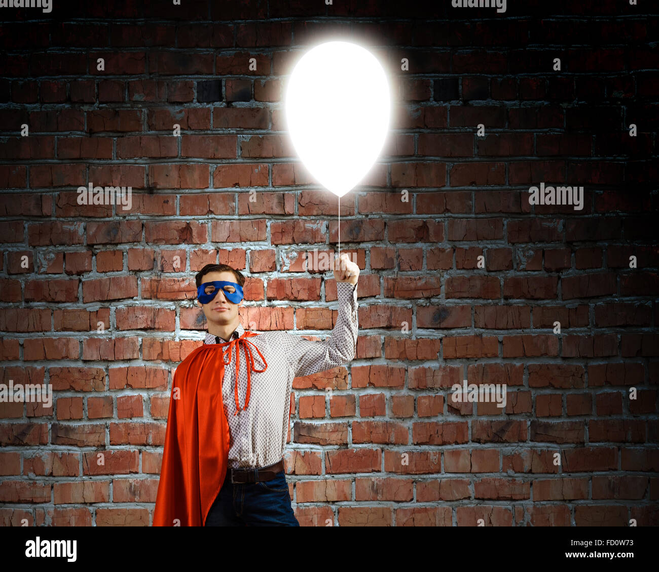Young confident superman in mask and cape Stock Photo - Alamy