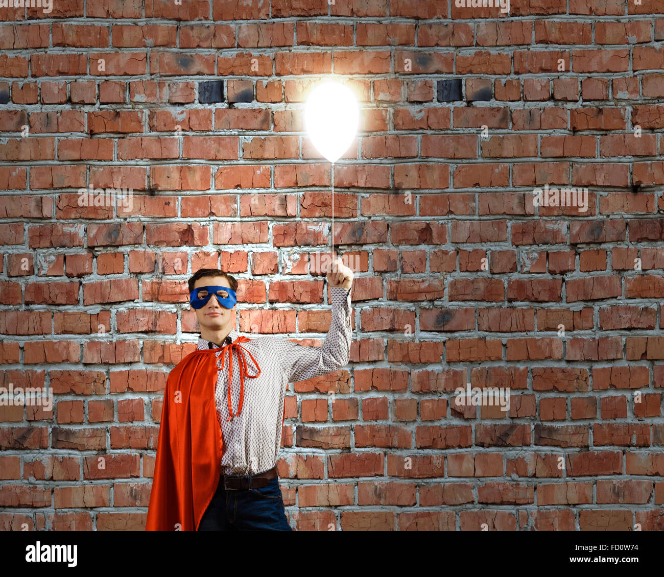 Young confident superman in mask and cape Stock Photo - Alamy