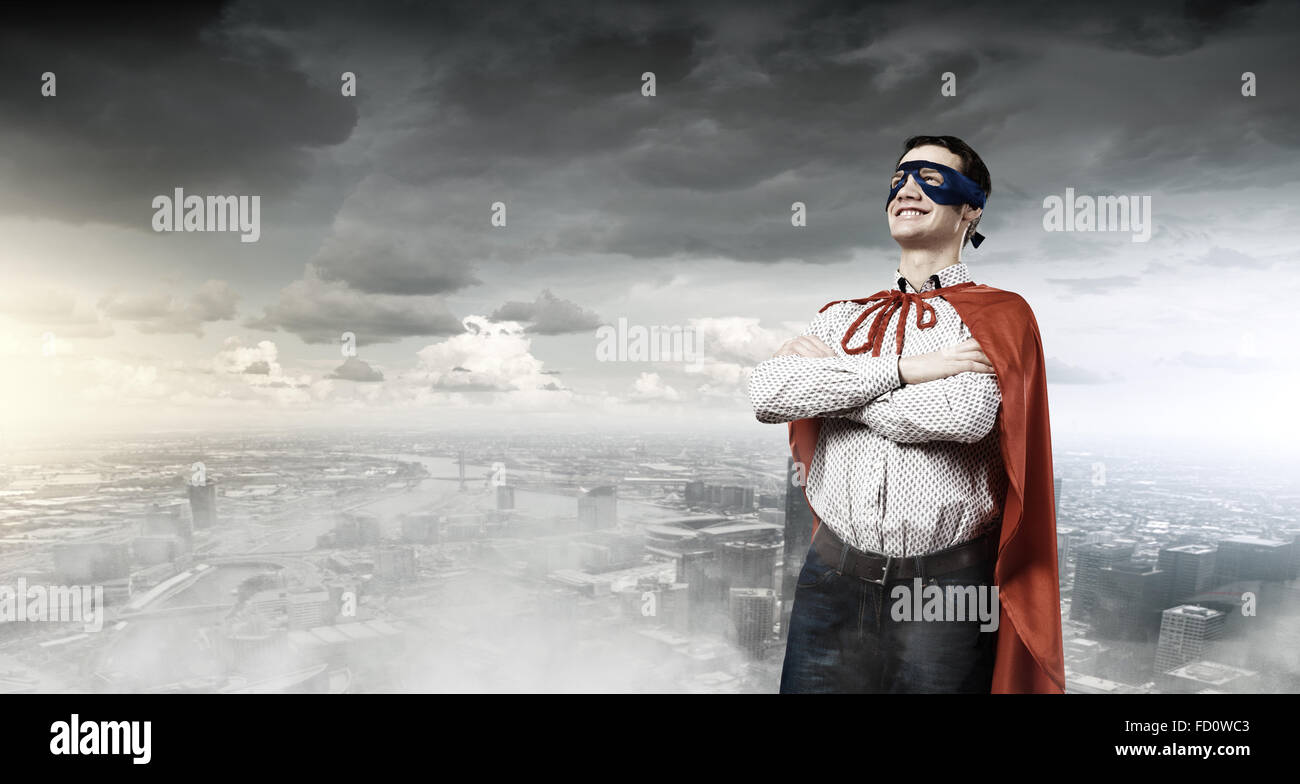 Young man wearing superman mask and cape Stock Photo - Alamy