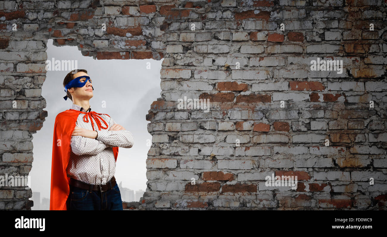 Young man wearing superman mask and cape Stock Photo - Alamy