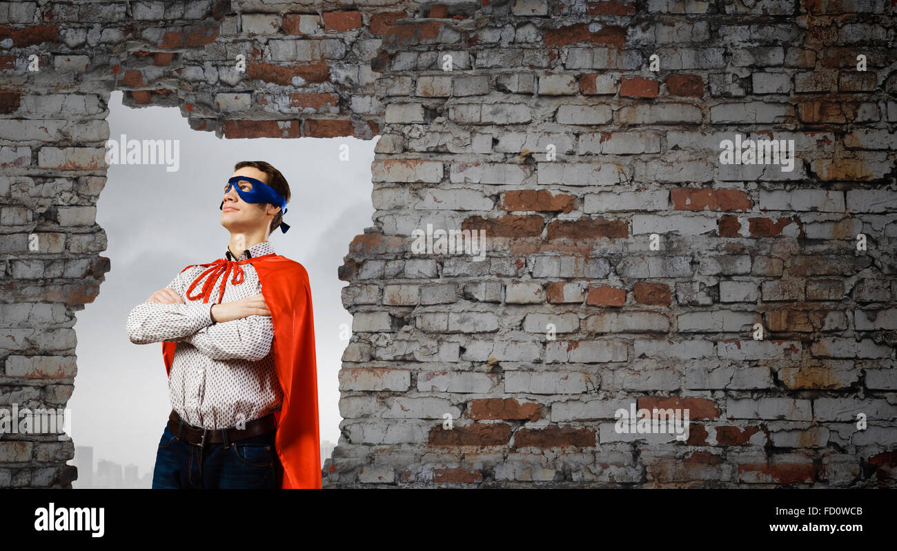 Young man wearing superman mask and cape Stock Photo - Alamy