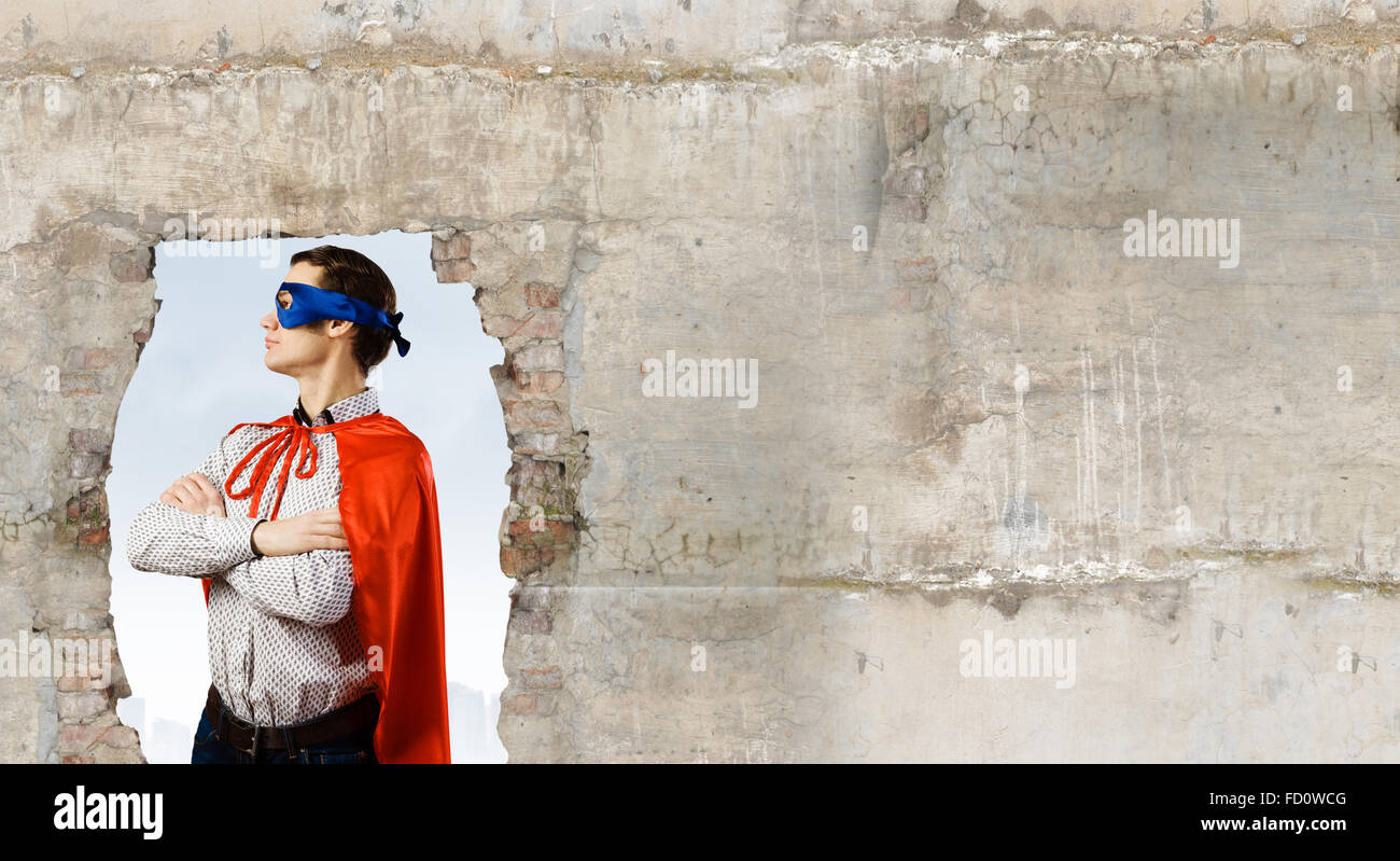 Young man wearing superman mask and cape Stock Photo - Alamy