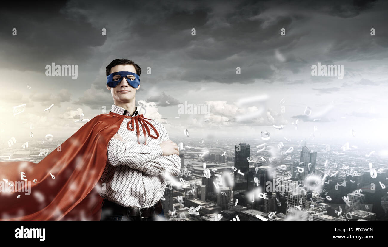 Young man wearing superman mask and cape Stock Photo - Alamy