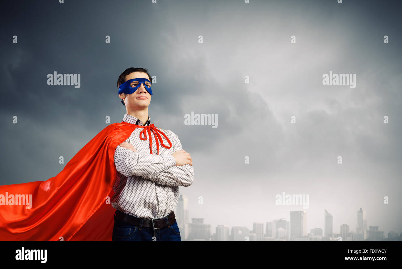 Young man wearing superman mask and cape Stock Photo - Alamy