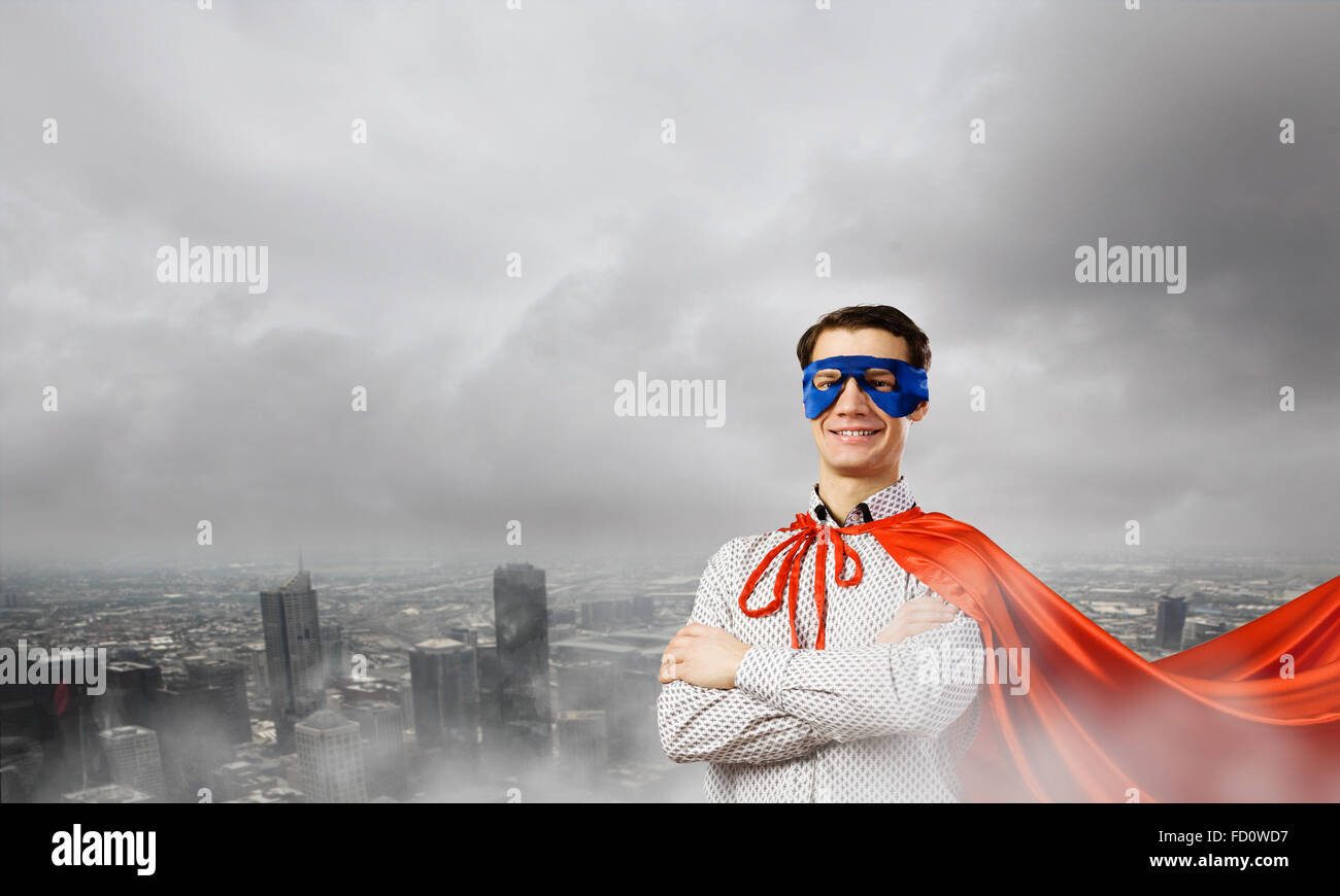 Young man wearing superman mask and cape Stock Photo - Alamy