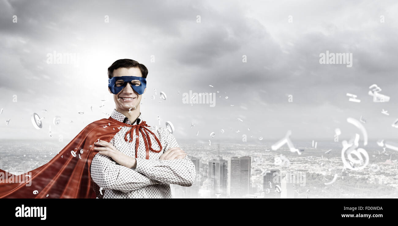 Young man wearing superman mask and cape Stock Photo - Alamy