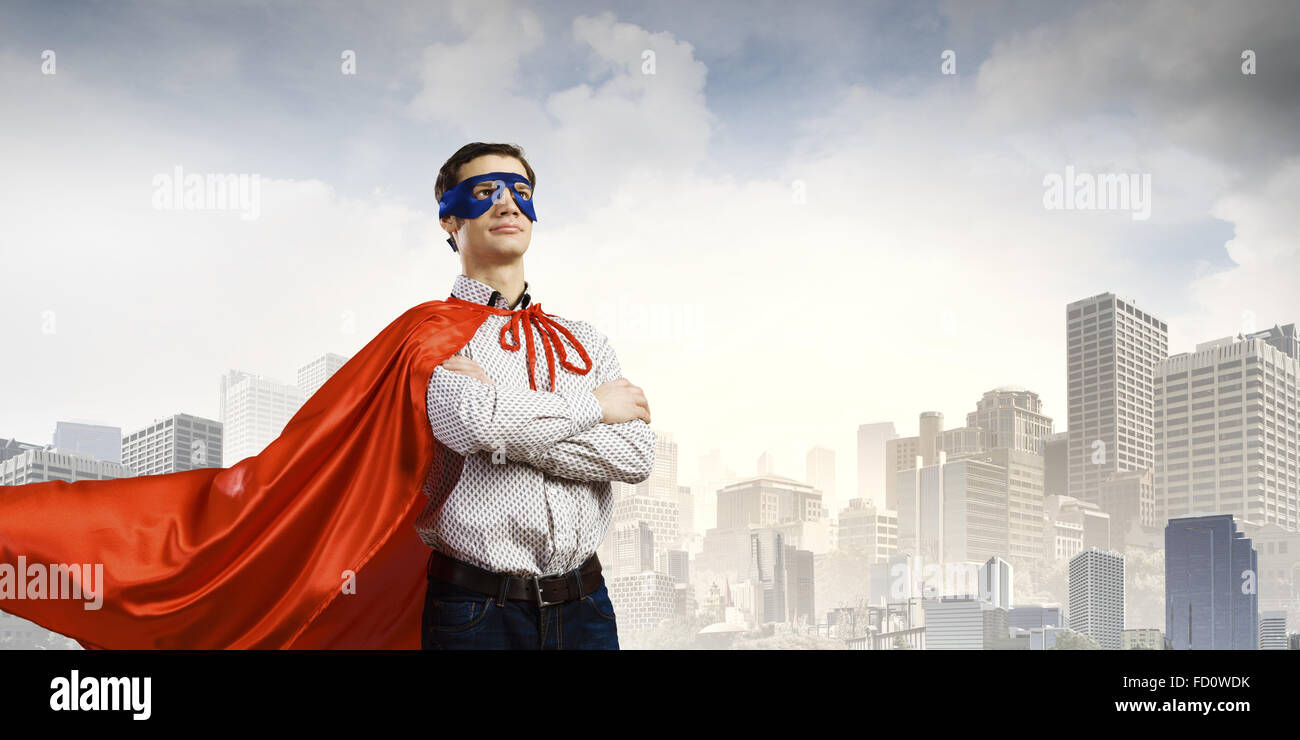 Young man wearing superman mask and cape Stock Photo - Alamy