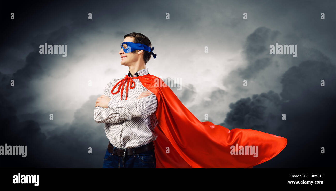 Young man wearing superman mask and cape Stock Photo - Alamy