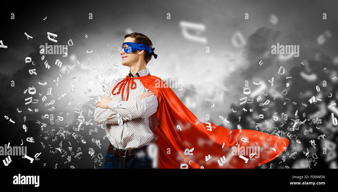 Young man wearing superman mask and cape Stock Photo - Alamy