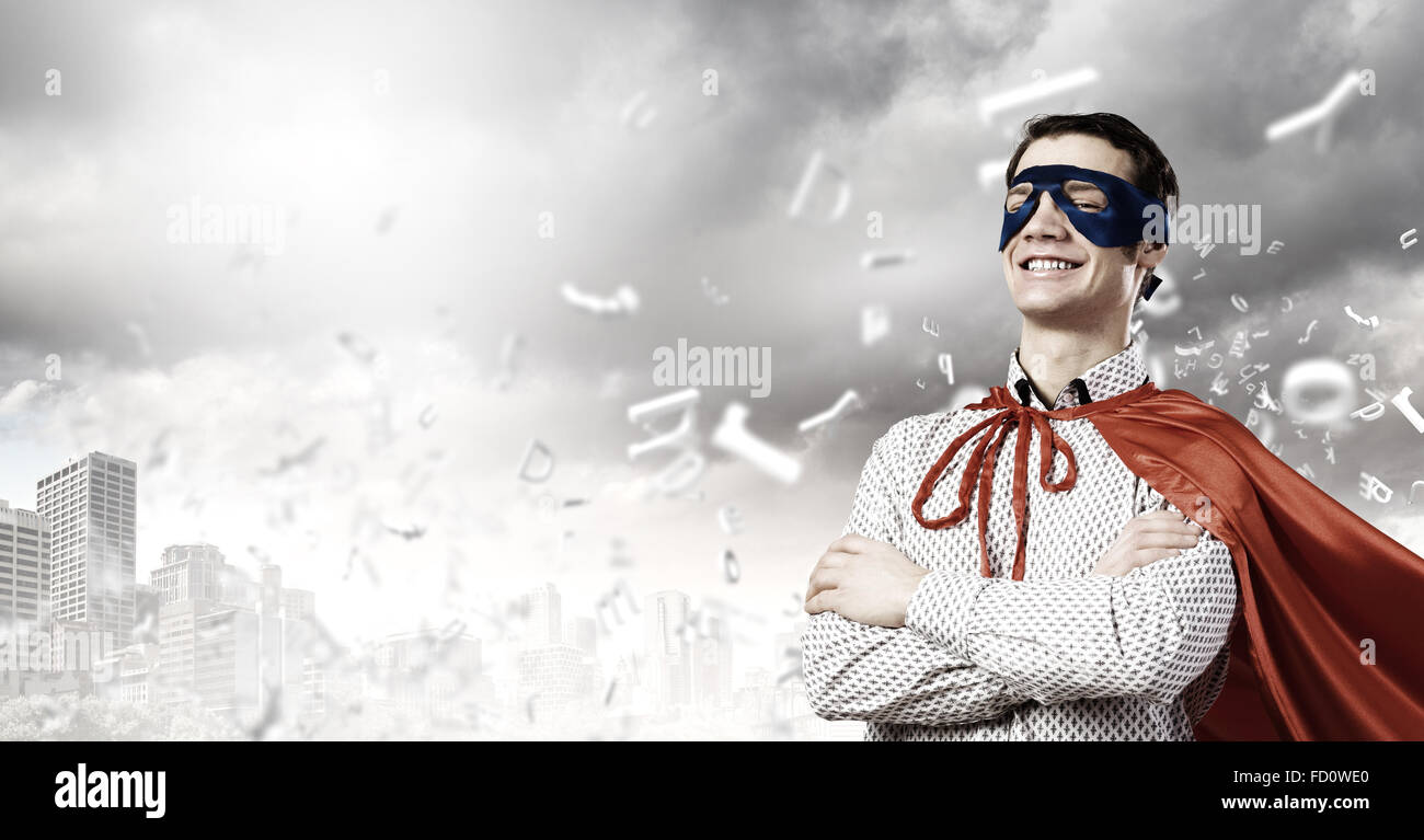 Young man wearing superman mask and cape Stock Photo - Alamy