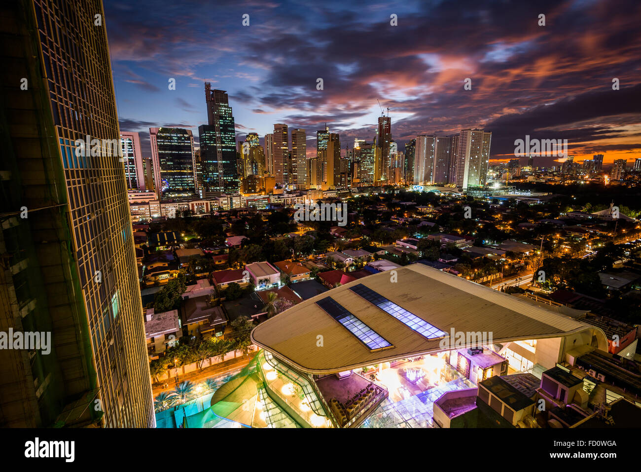 View of the skyline of Makati at sunset, in Metro Manila, The ...
