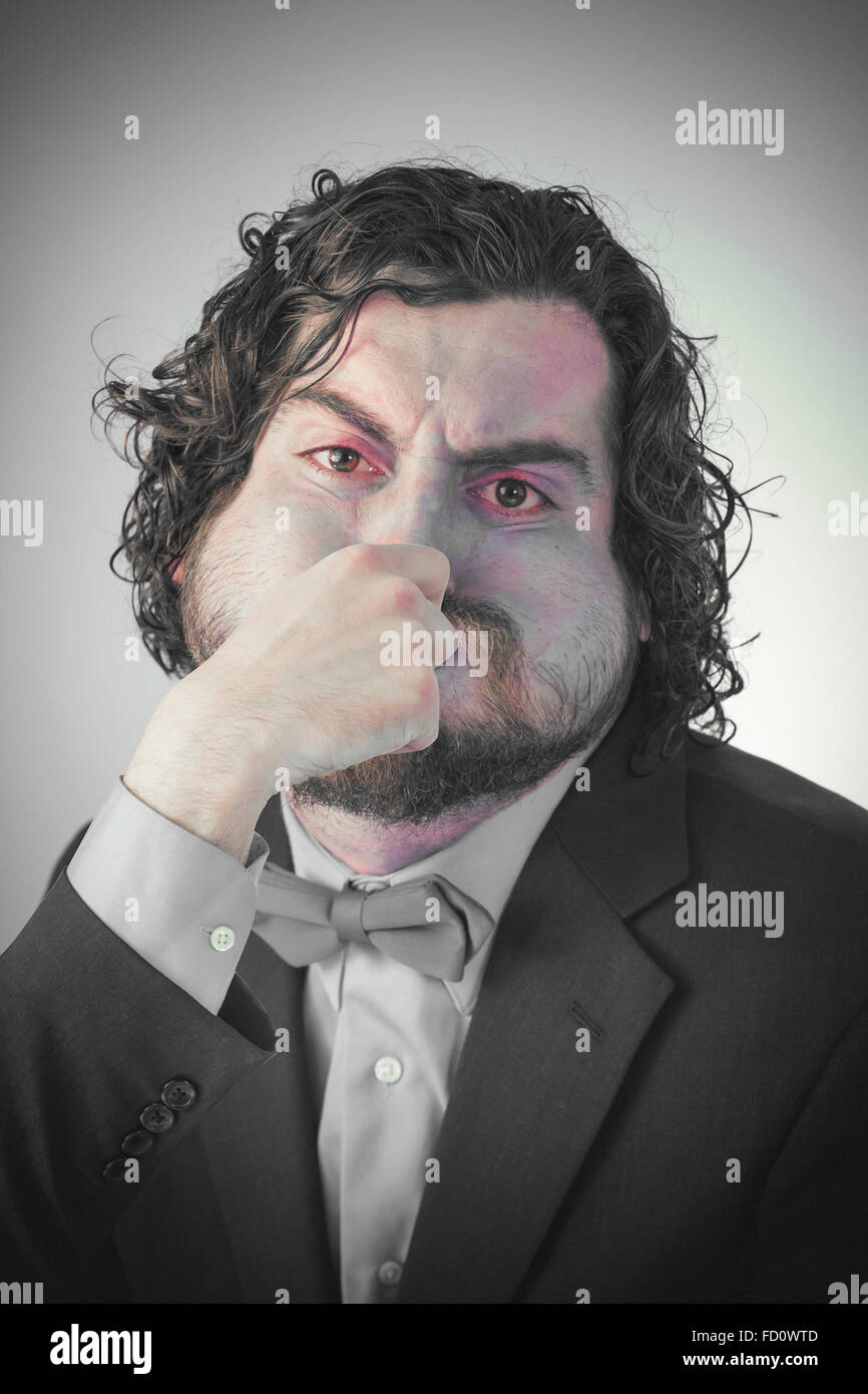 Bearded man holds his breath in anticipation and is turning blue Stock ...