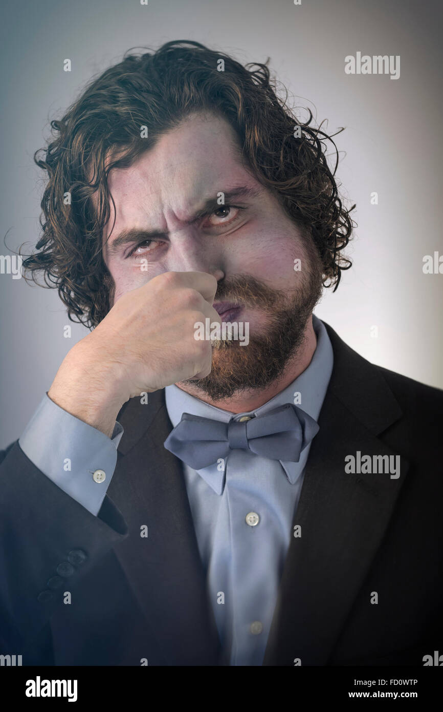 Bearded man holds his breath in anticipation and is turning blue Stock ...