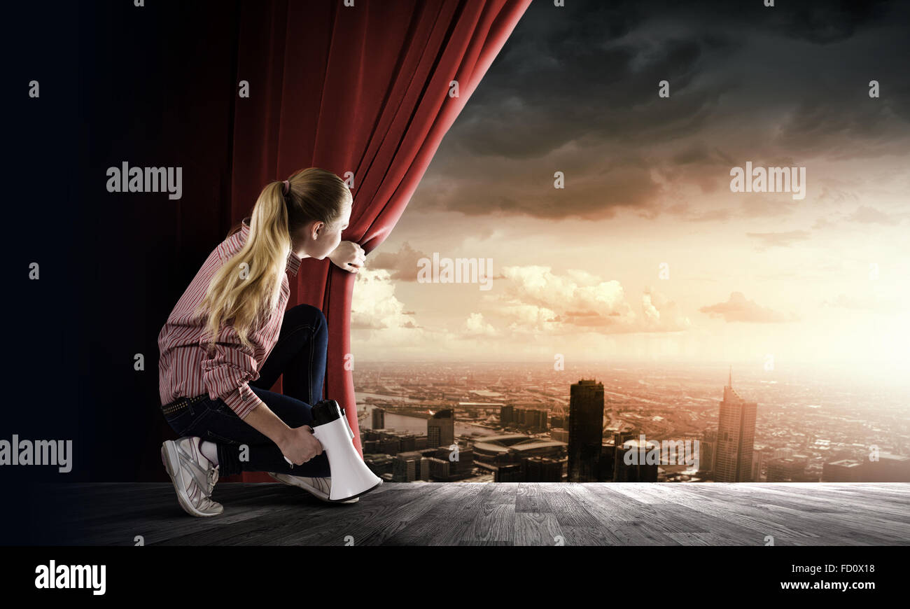Young girl on stage with megaphone opening red curtain Stock Photo - Alamy