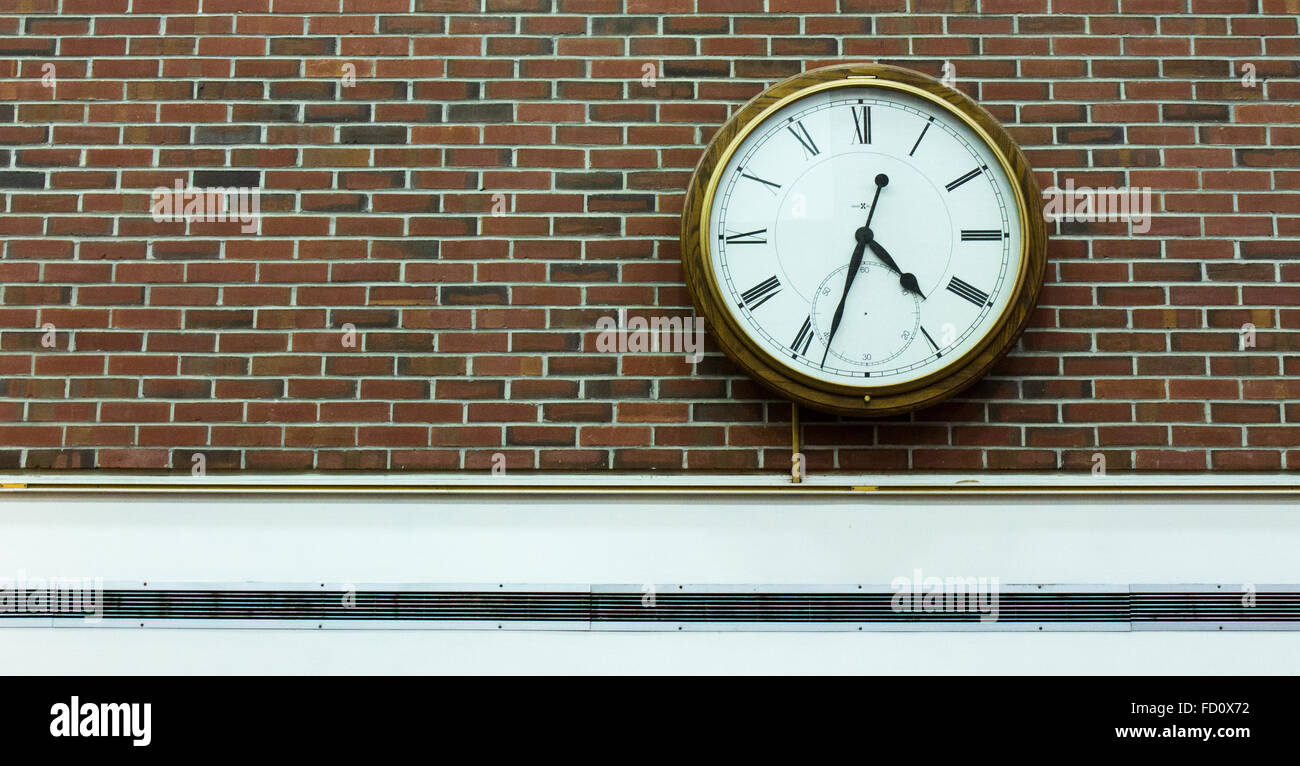 A clock in a brick wall Stock Photo - Alamy